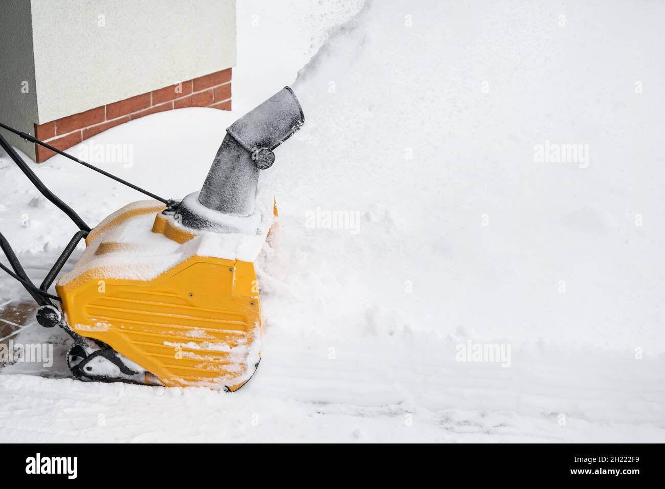 Removing of snow in yard Stock Photo - Alamy