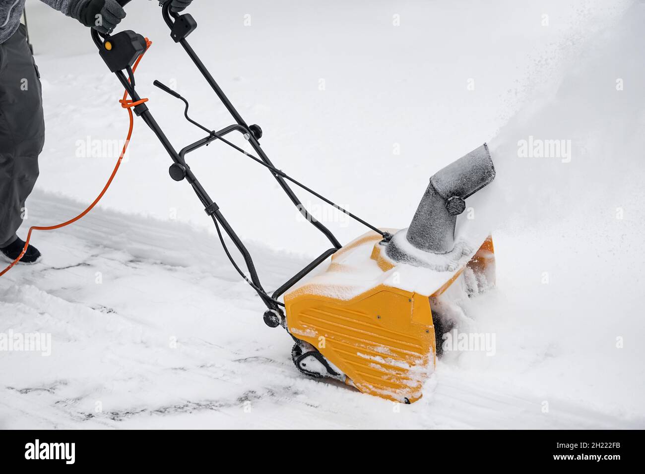 Removing of snow in yard Stock Photo - Alamy