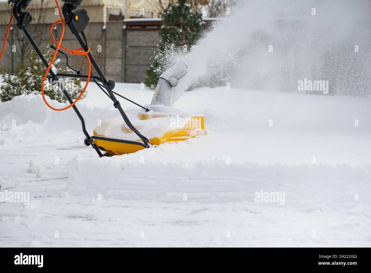 Removing of snow in yard Stock Photo - Alamy