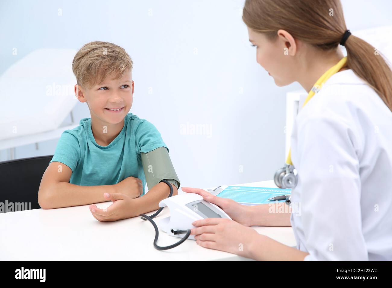 Nurse checking boy pulse hi-res stock photography and images - Alamy