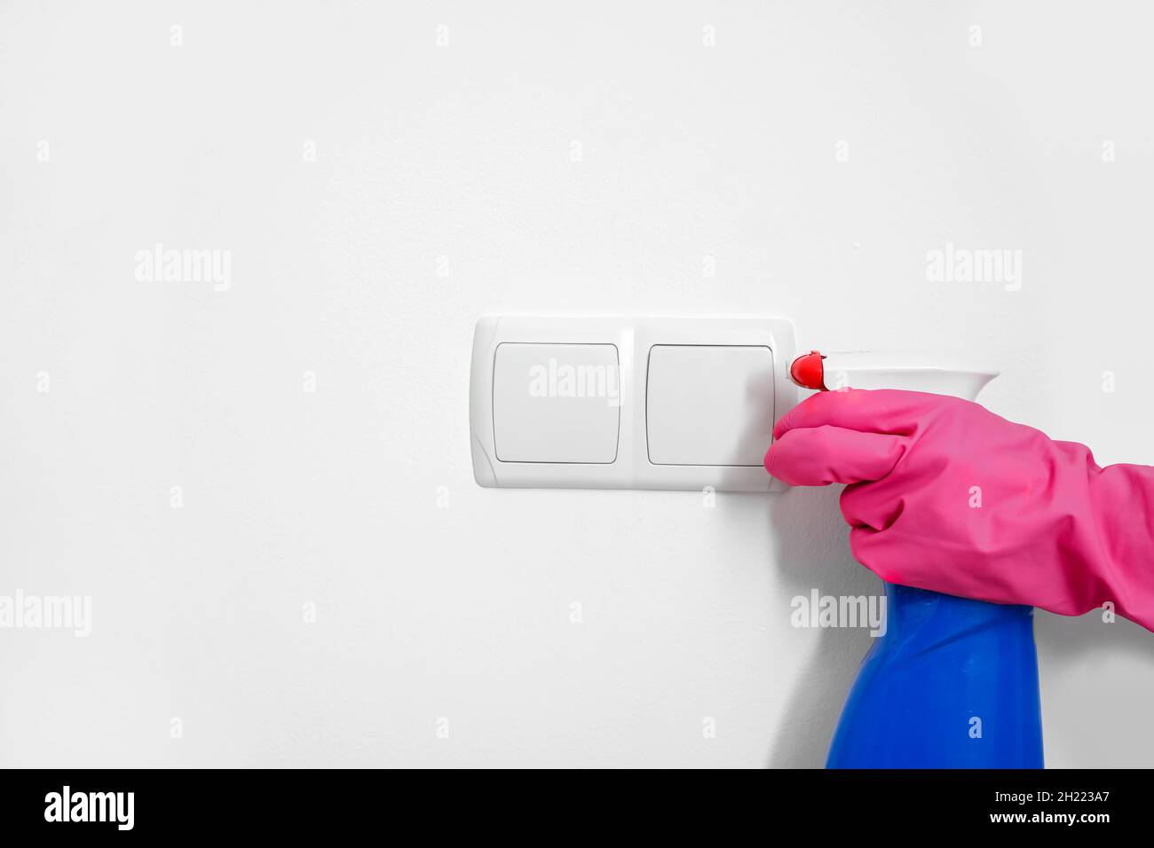 Woman cleaning light switch hi-res stock photography and images - Alamy