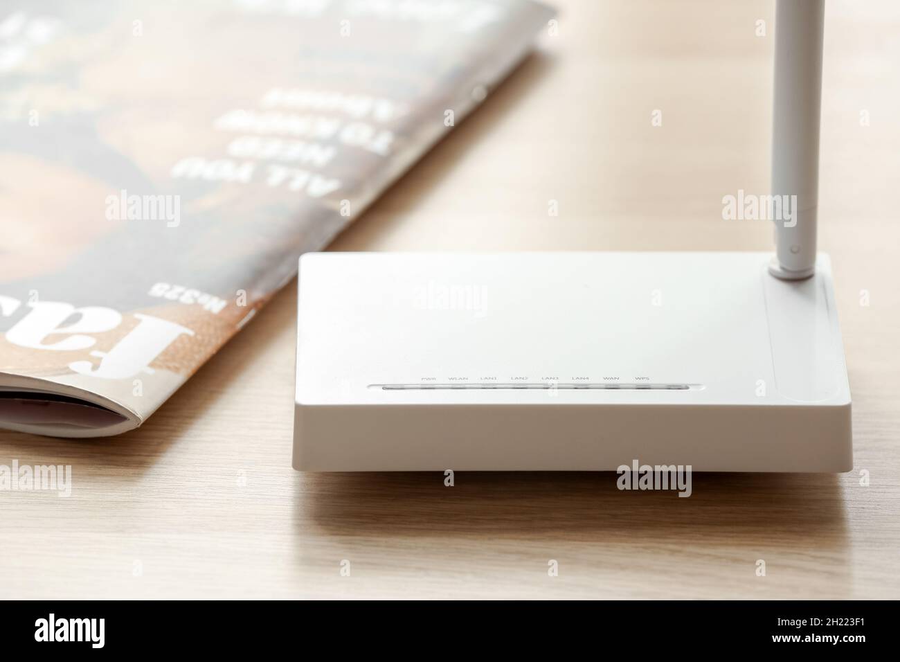 Modern wi-fi router on table in room Stock Photo - Alamy