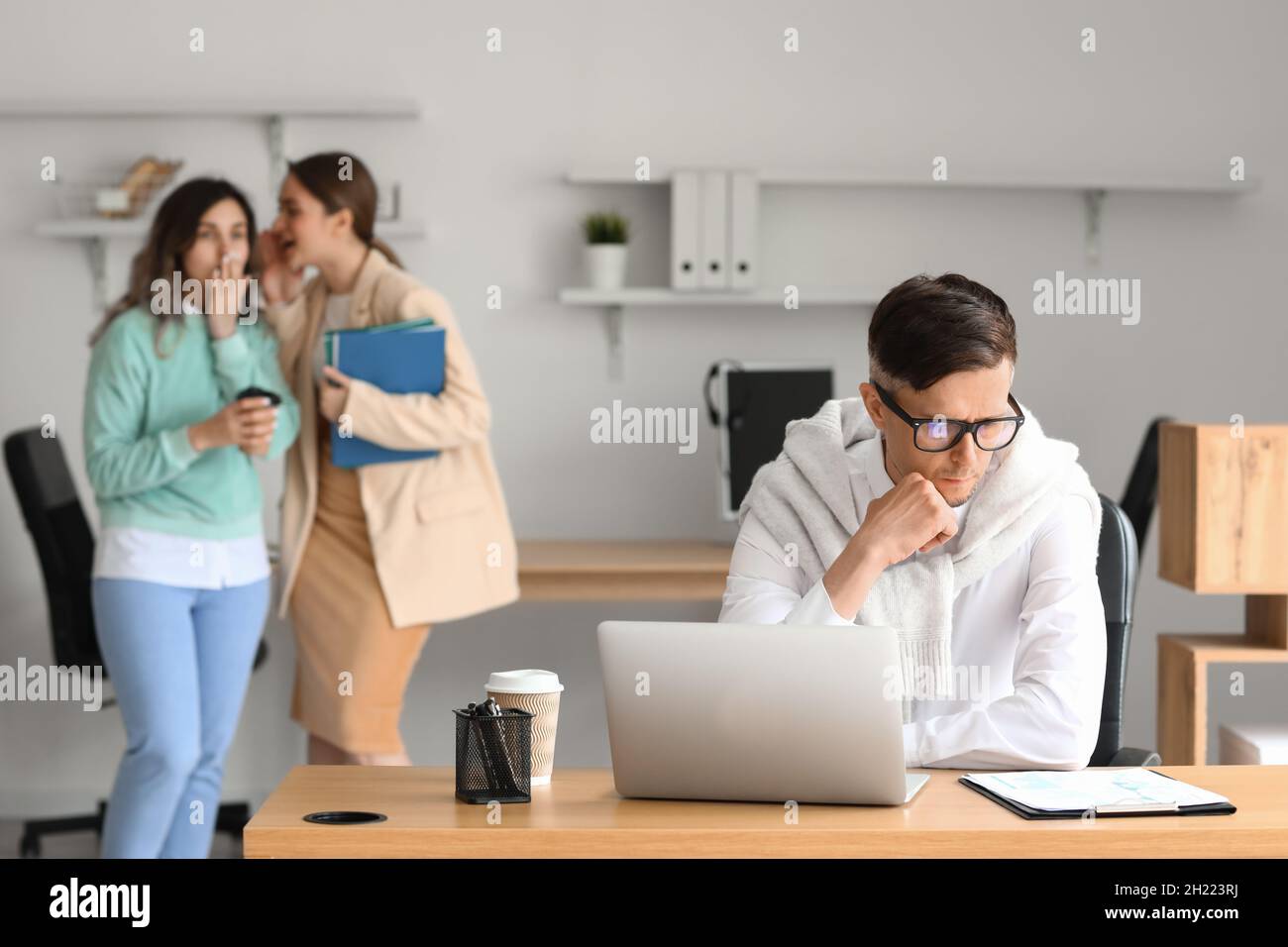 Women gossiping about their colleague in office Stock Photo - Alamy