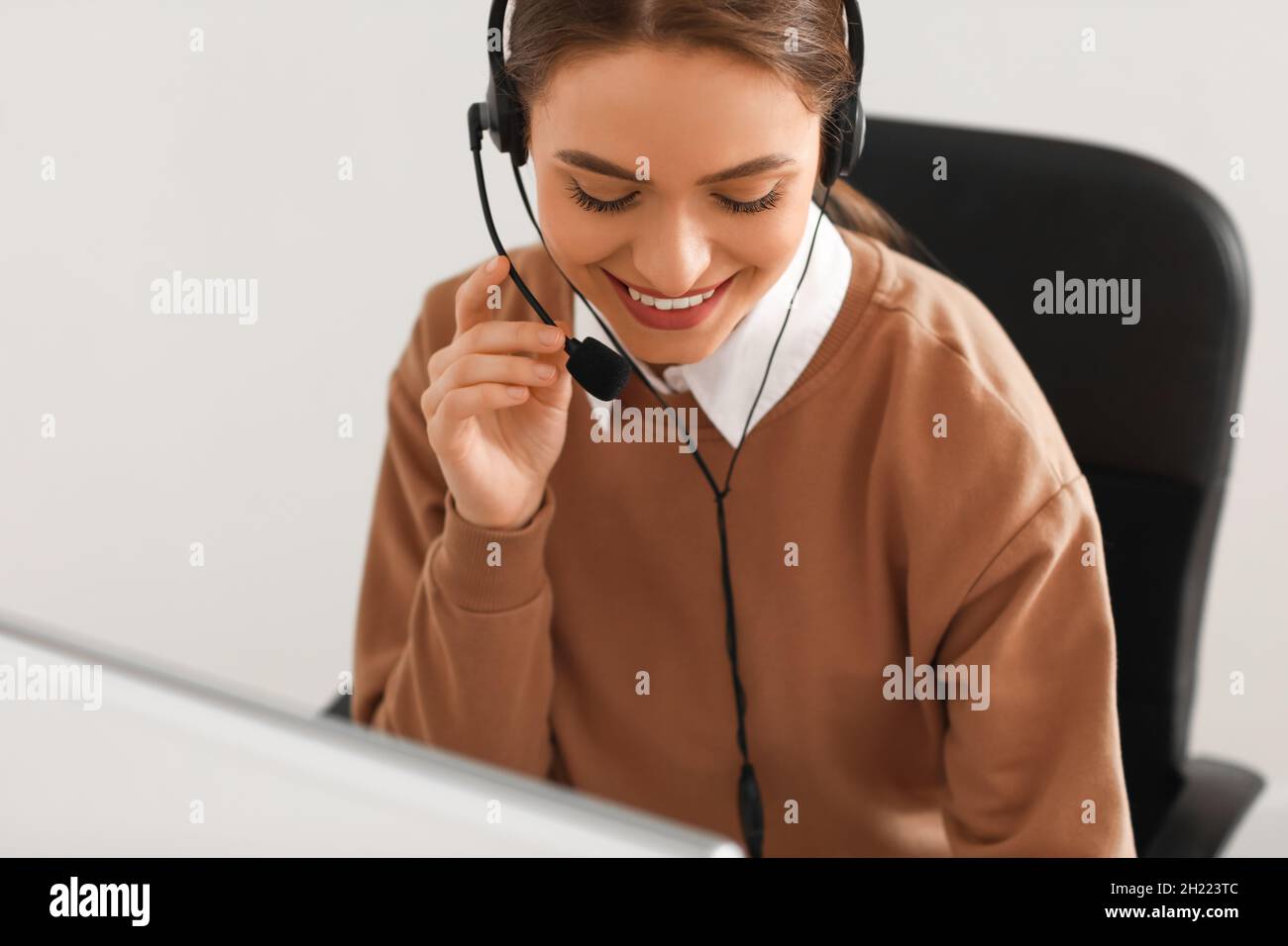 Technical support agent working in office Stock Photo - Alamy