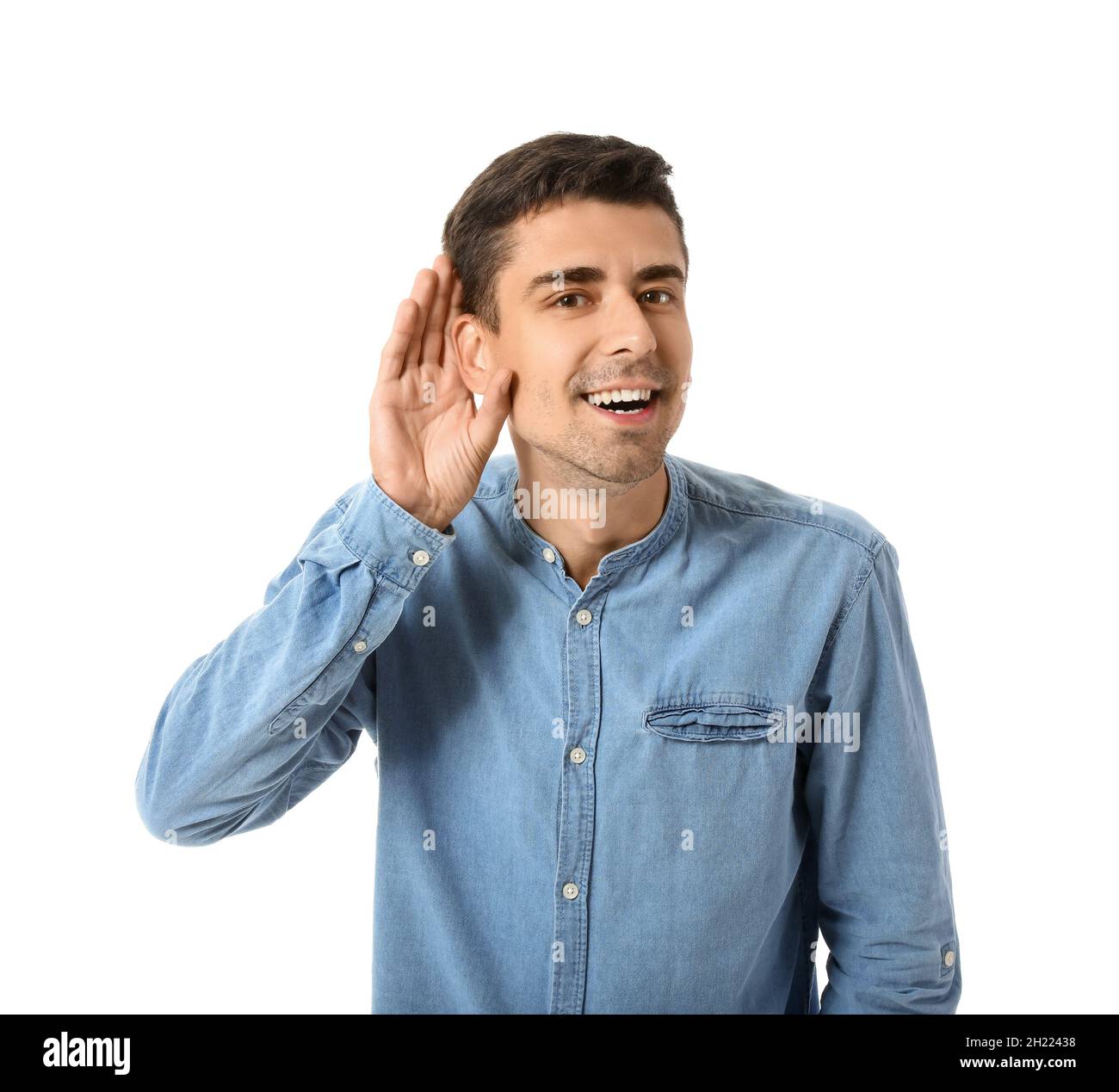 Young gossip man trying to hear something on white background Stock ...