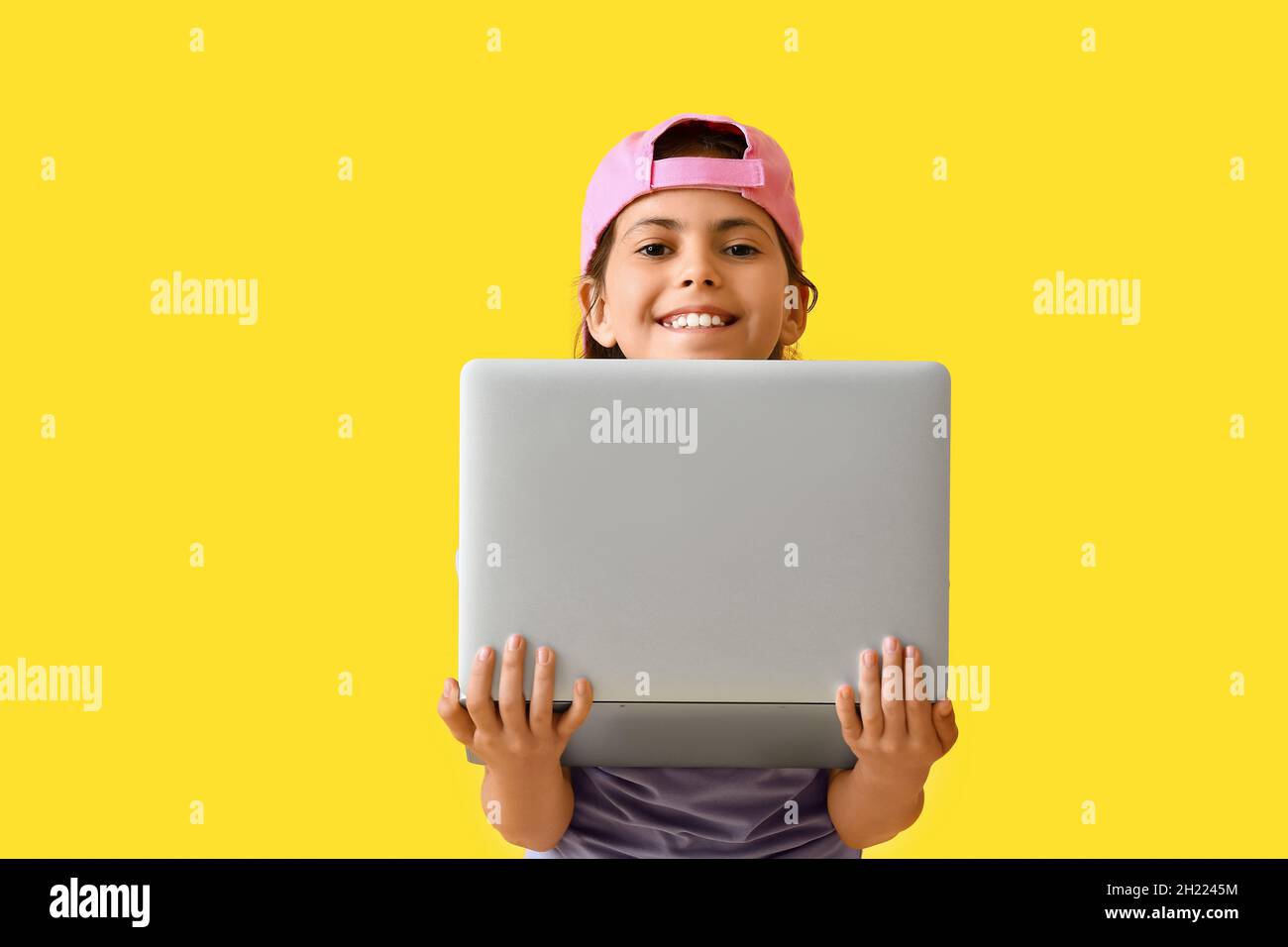 Little programmer with laptop on color background Stock Photo - Alamy