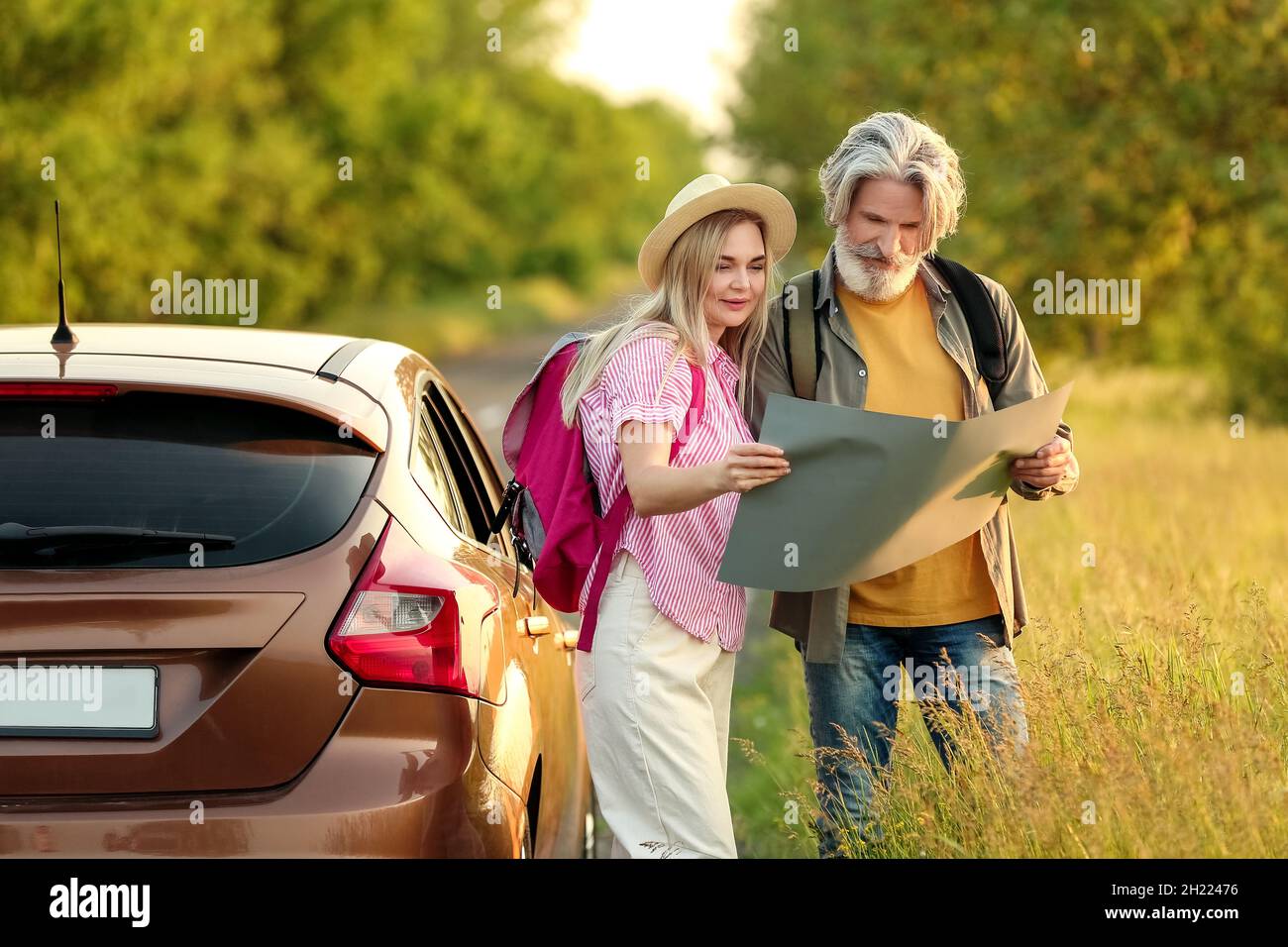 Happy middle aged couple map in hi-res stock photography and images - Alamy