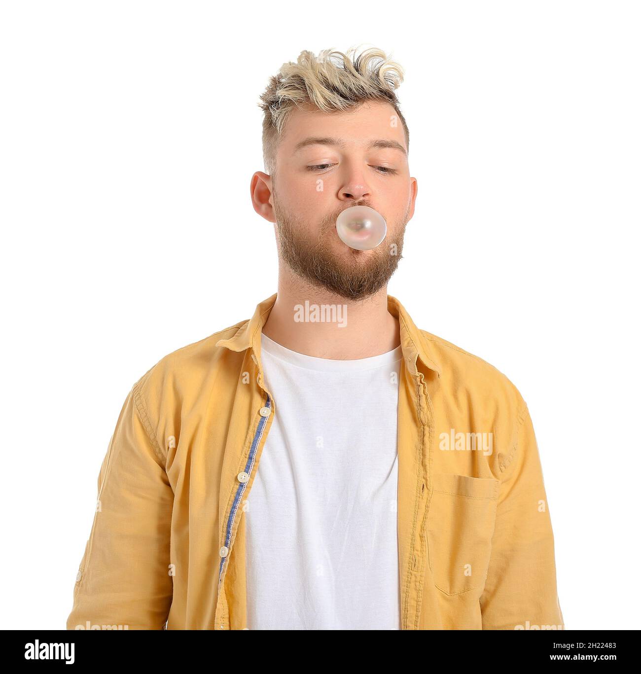 Young man with chewing gum on white background Stock Photo - Alamy