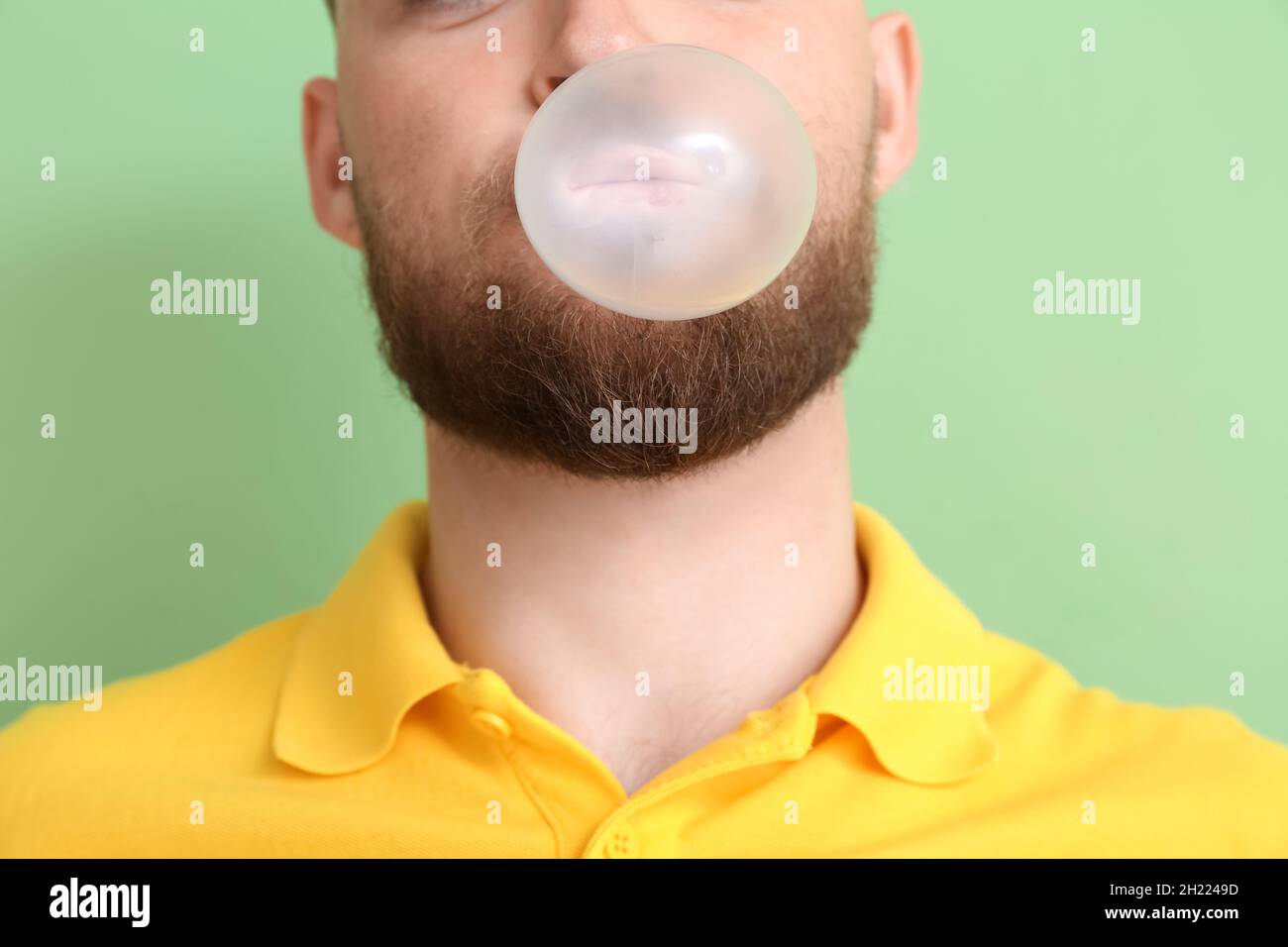 Bearded man chewing gum blowing hi-res stock photography and images - Alamy