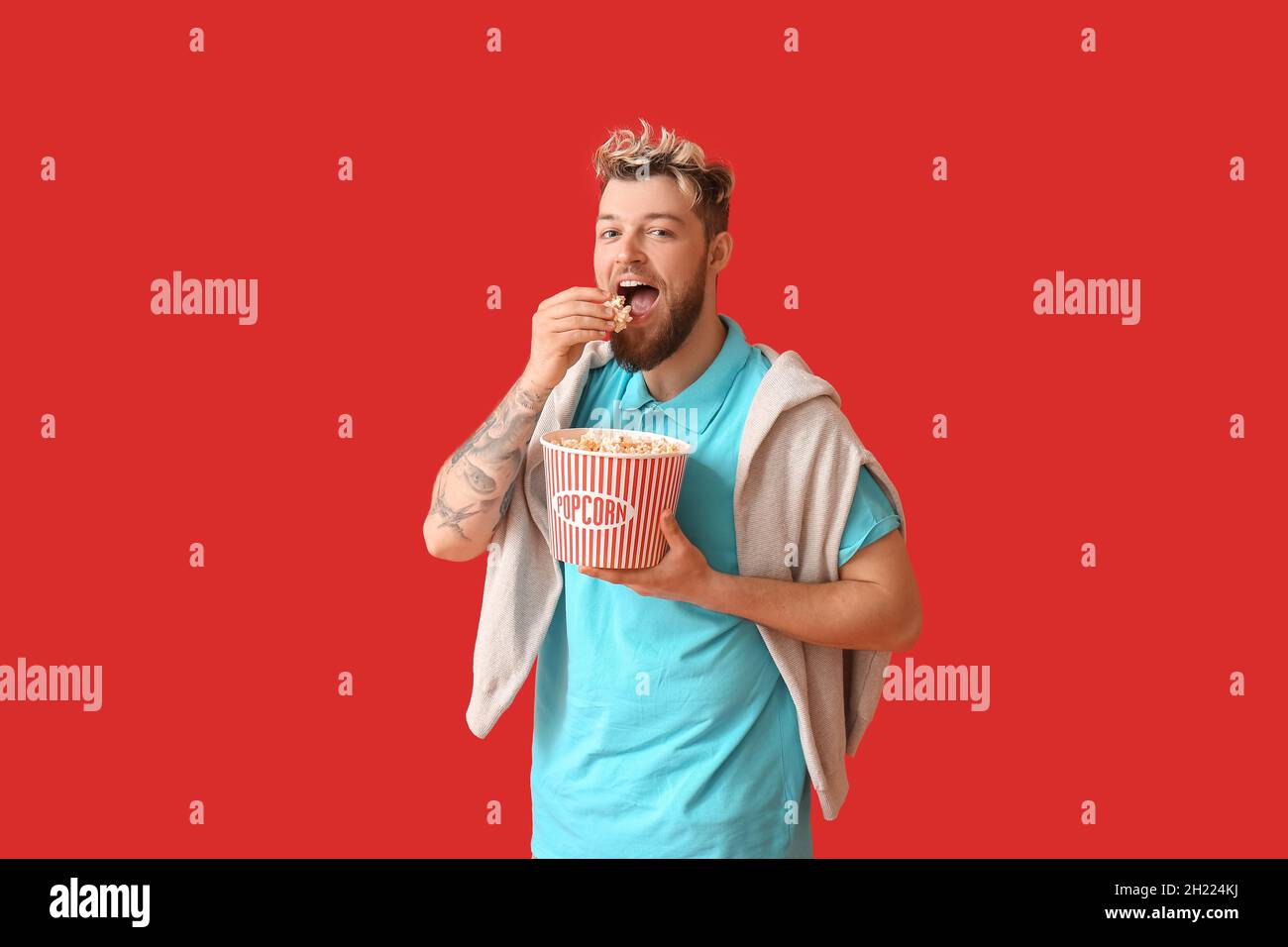 Portrait happy teenager eating popcorn hi-res stock photography and ...