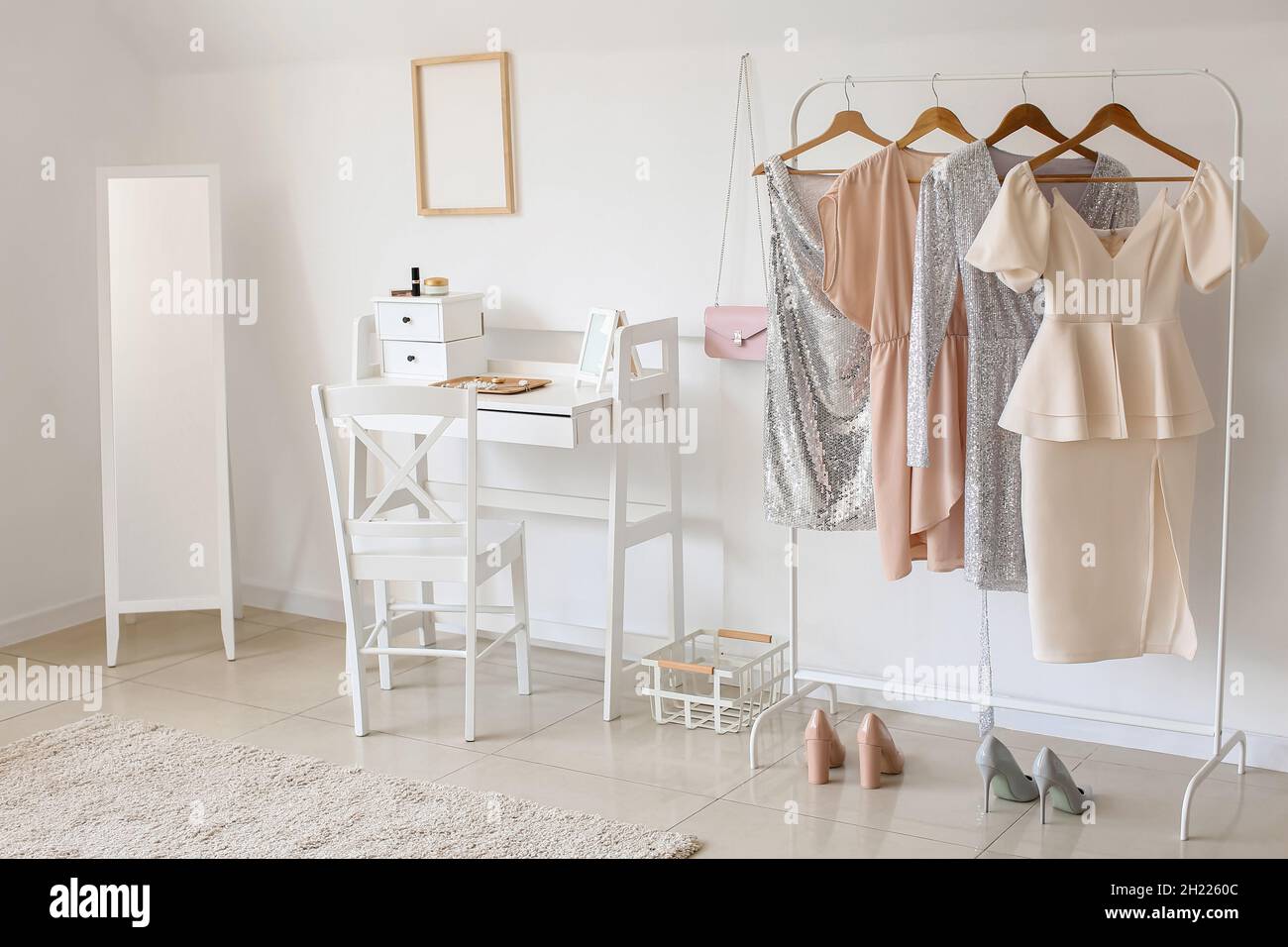 Interior of stylish room with clothes Stock Photo - Alamy