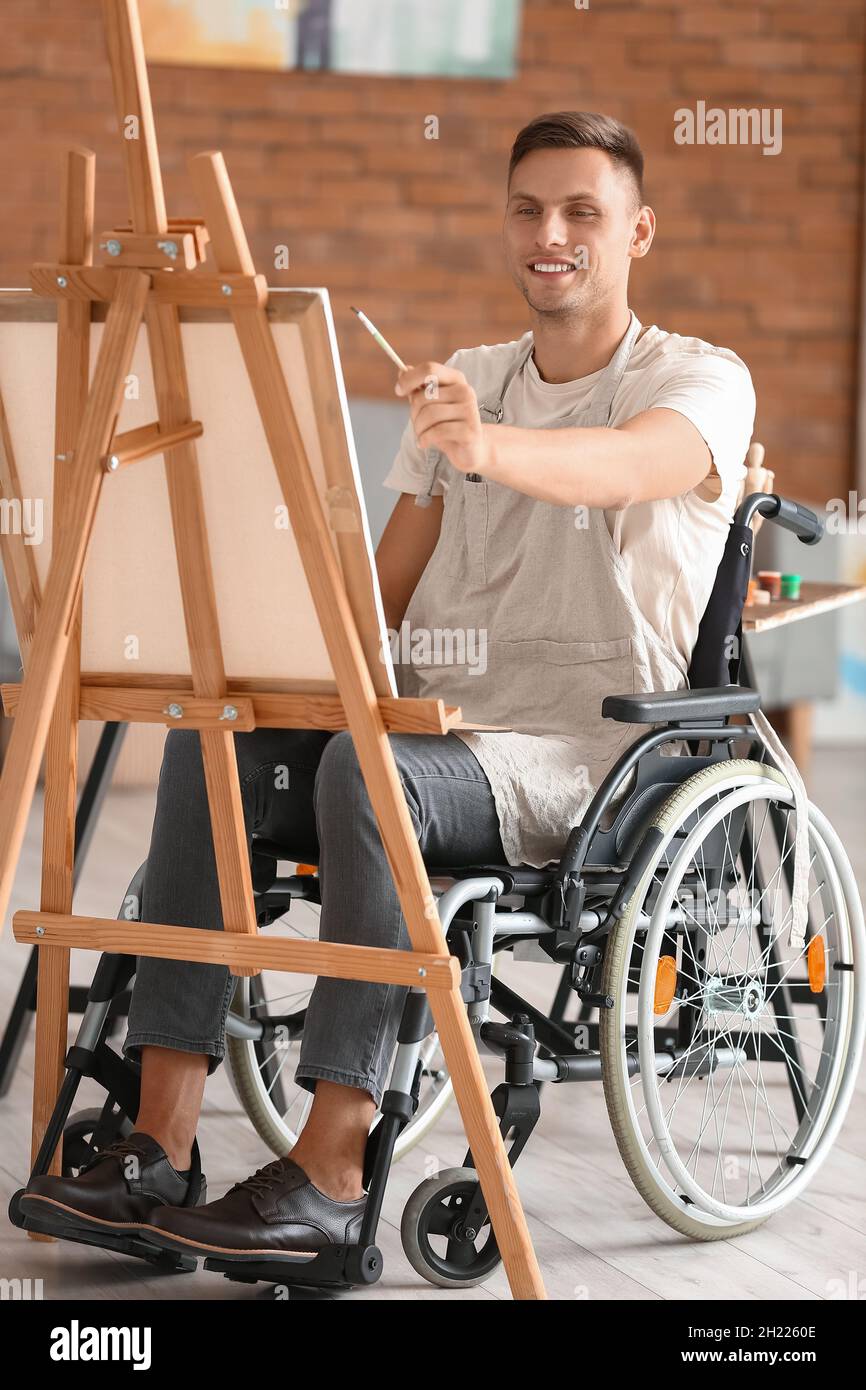 Young handicapped artist drawing hi-res stock photography and images ...