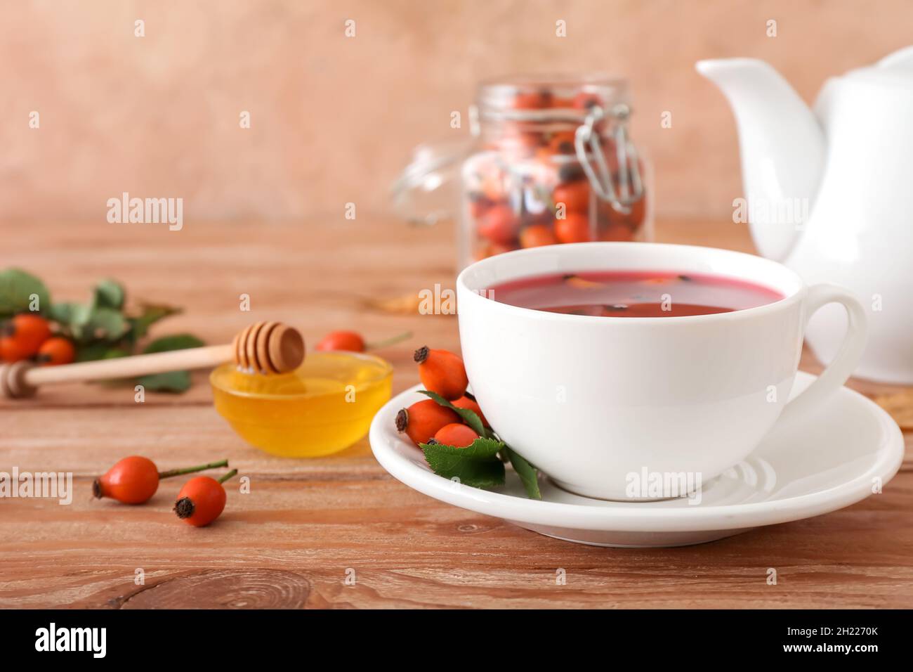 Cup of rose hip tea on table Stock Photo - Alamy