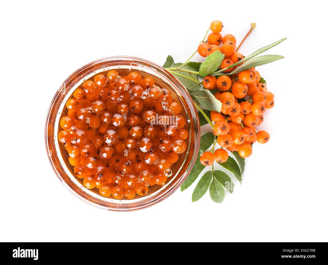 Glass bowl of tasty rowan jam on white background Stock Photo - Alamy