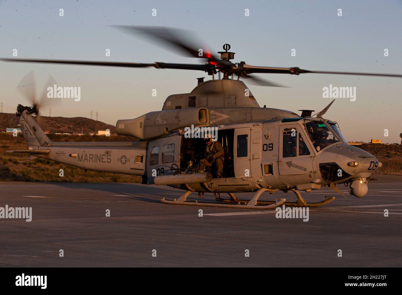 A U.S. Marine UH-1Y Venom helicopter with Marine Light Attack ...