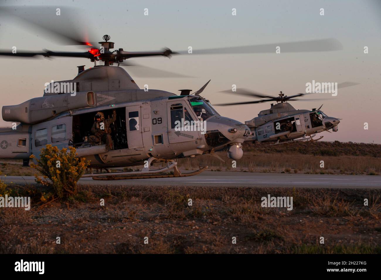 Two U.S. Marine UH-1Y Venom helicopters with Marine Light Attack ...