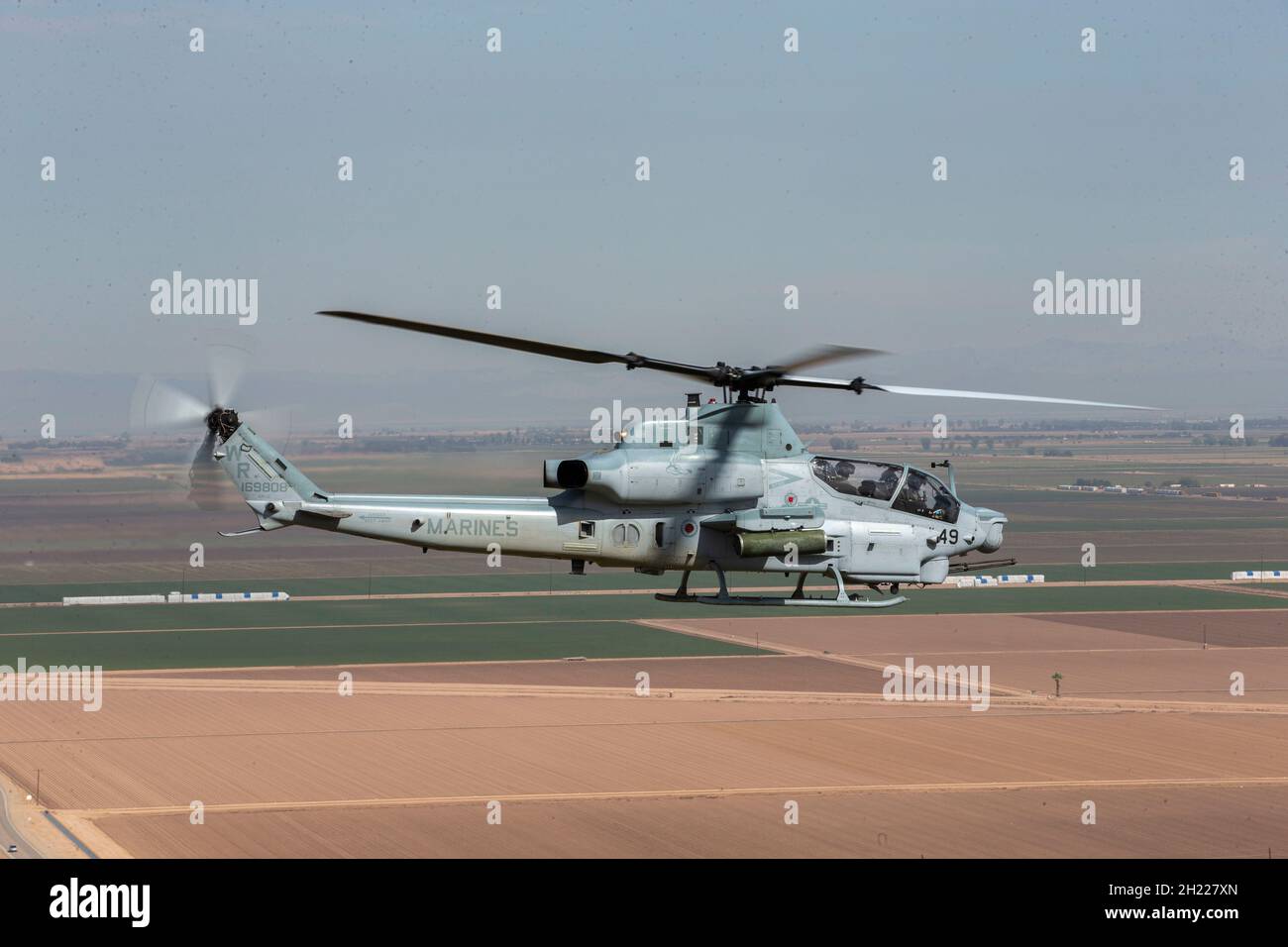 A U.S. Marine AH-1Z Viper helicopter with Marine Light Attack ...