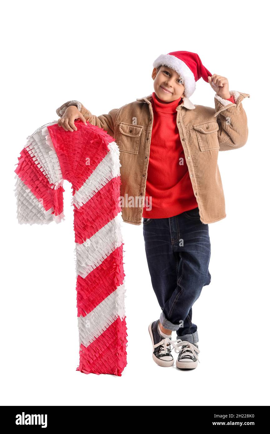 Cute little boy with candy cane pinata on white background Stock Photo ...