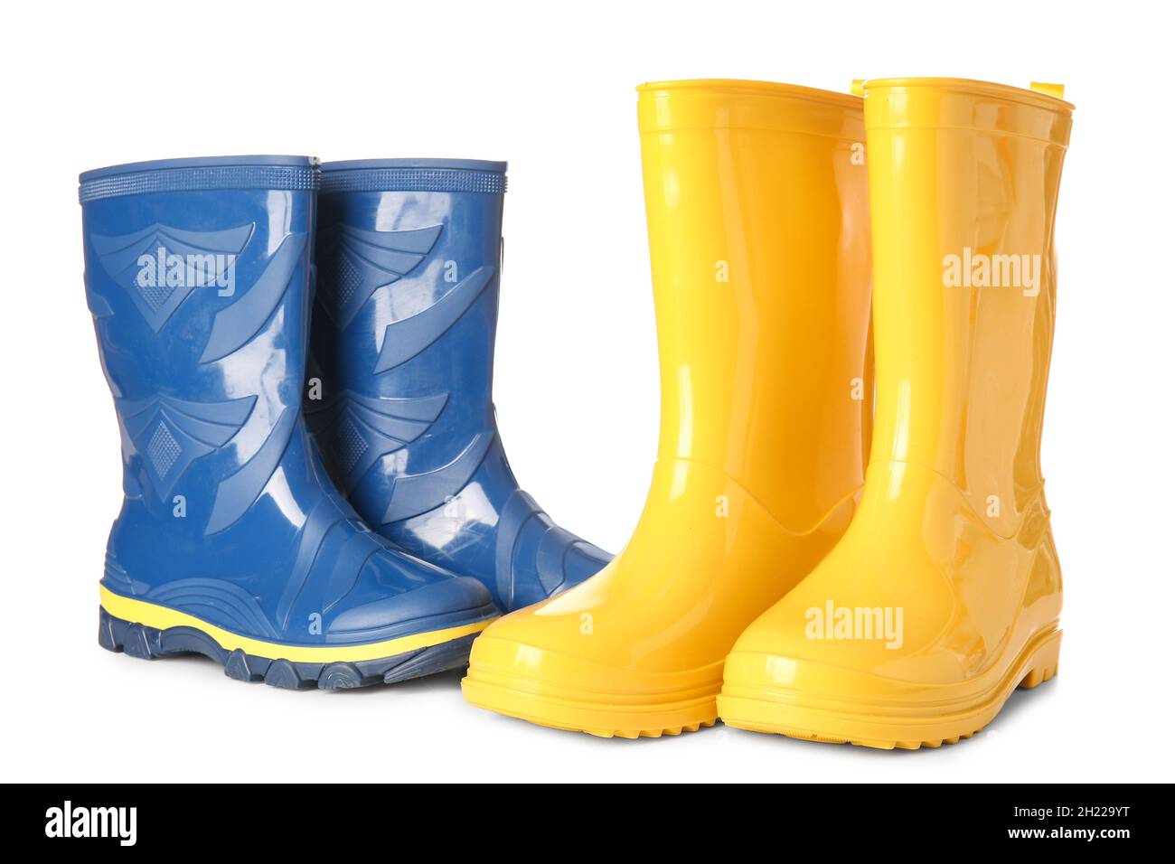 Different rubber boots isolated on white background Stock Photo - Alamy