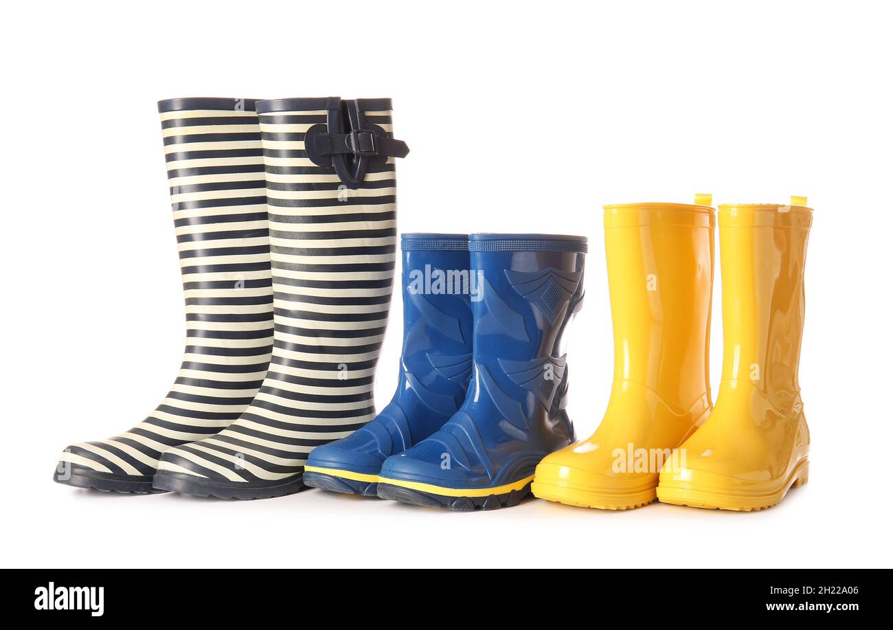 Many different rubber boots on white background Stock Photo - Alamy