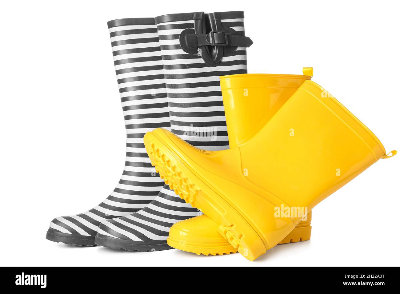 Two pairs of rubber boots on white background Stock Photo - Alamy