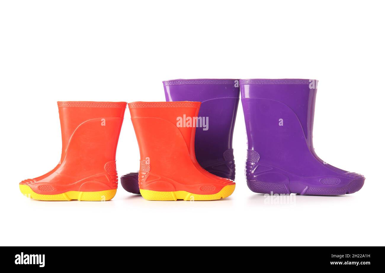 Different rubber boots on white background Stock Photo - Alamy