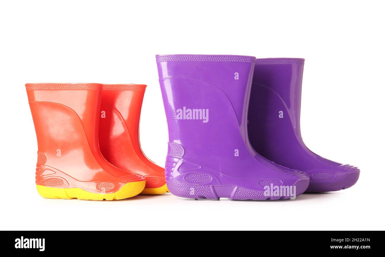 Different rubber boots on white background Stock Photo - Alamy