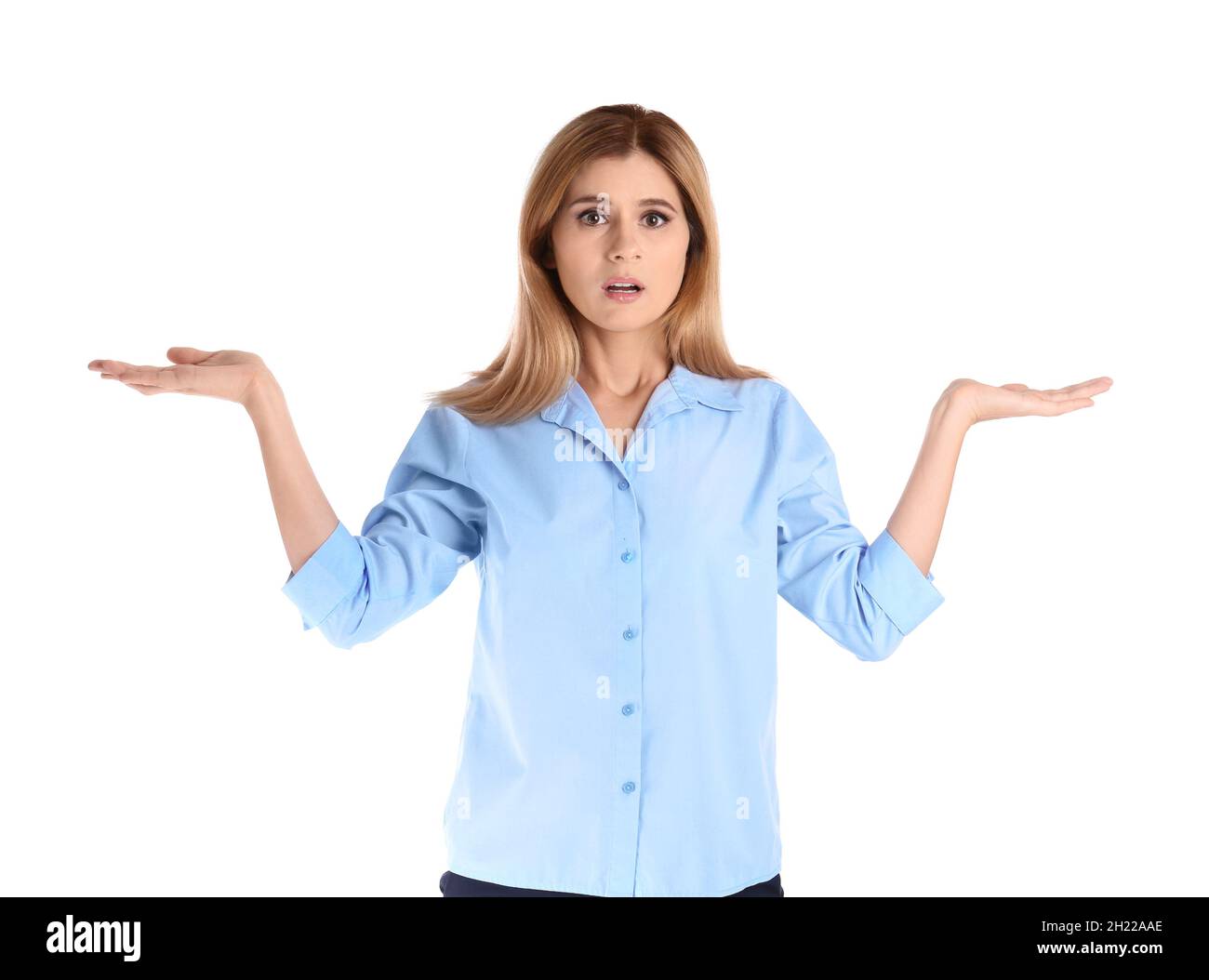 Portrait of businesswoman showing balance gesture on white background ...