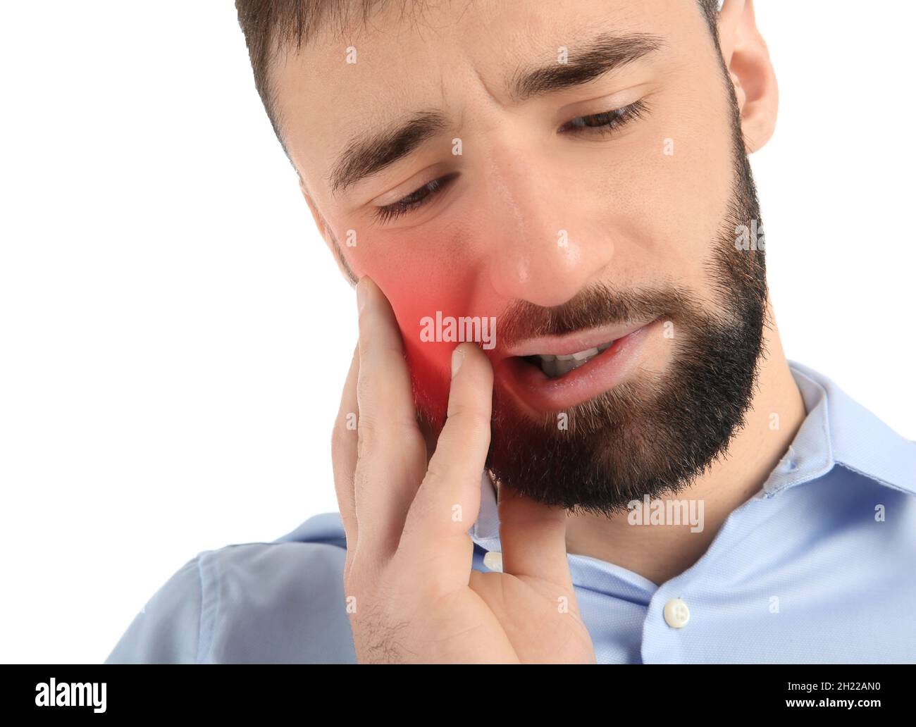 Young man suffering from teeth pain on white background Stock Photo - Alamy