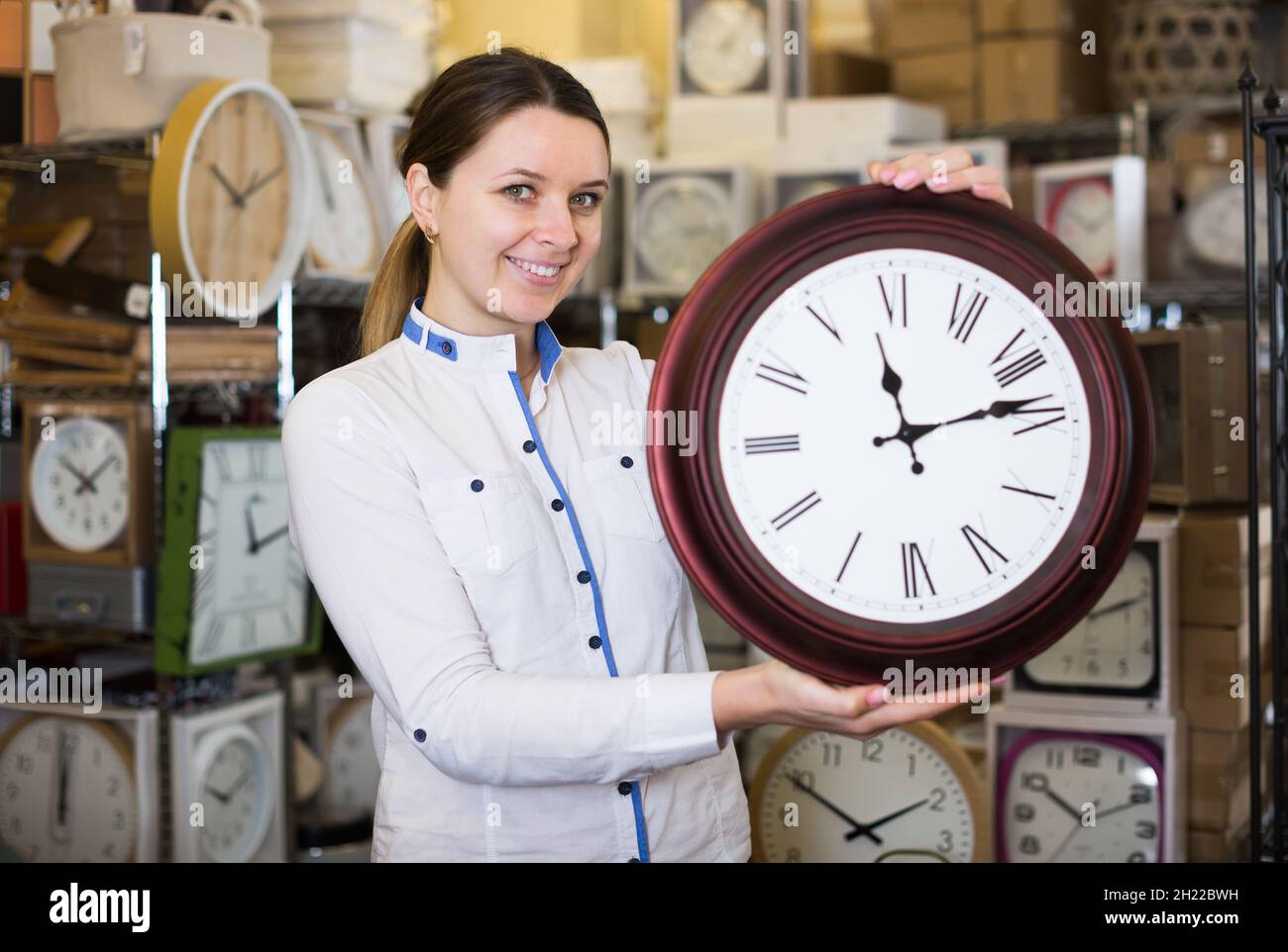 Woman with big clocks hi-res stock photography and images - Alamy