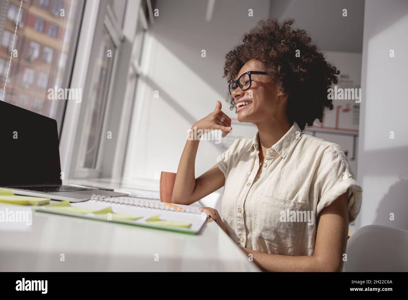 Smiling lady using laptop , watching lesson sign language online Stock ...