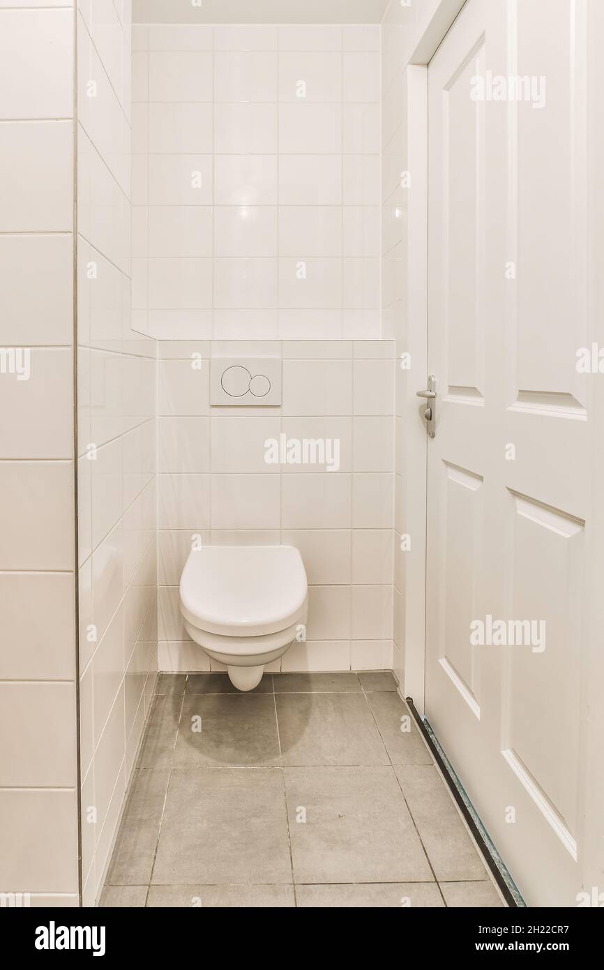 Interior of small clean restroom in miniature style Stock Photo - Alamy