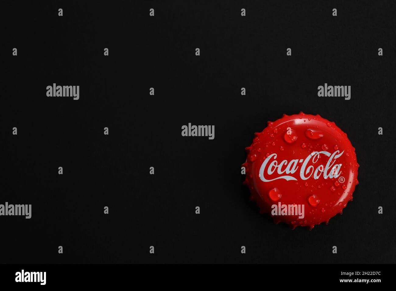 MYKOLAIV, UKRAINE - NOVEMBER 15, 2018: Coca Cola lid on black ...
