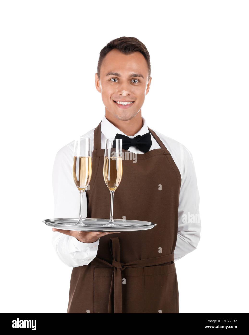 Waiter holding metal tray with glasses of champagne on white background ...