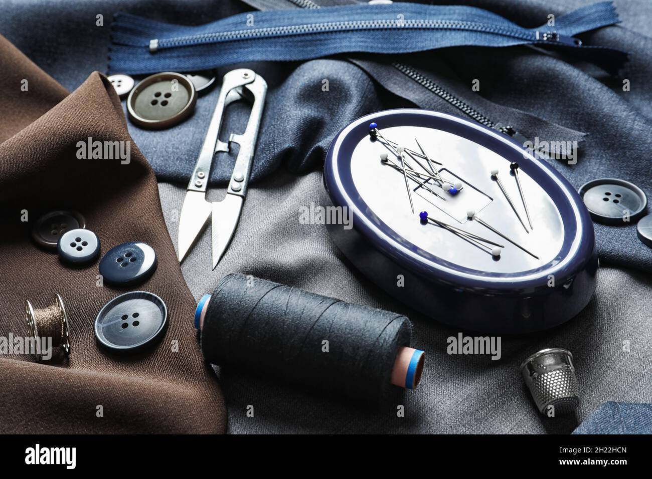 Set of tailoring accessories on fabric samples Stock Photo - Alamy