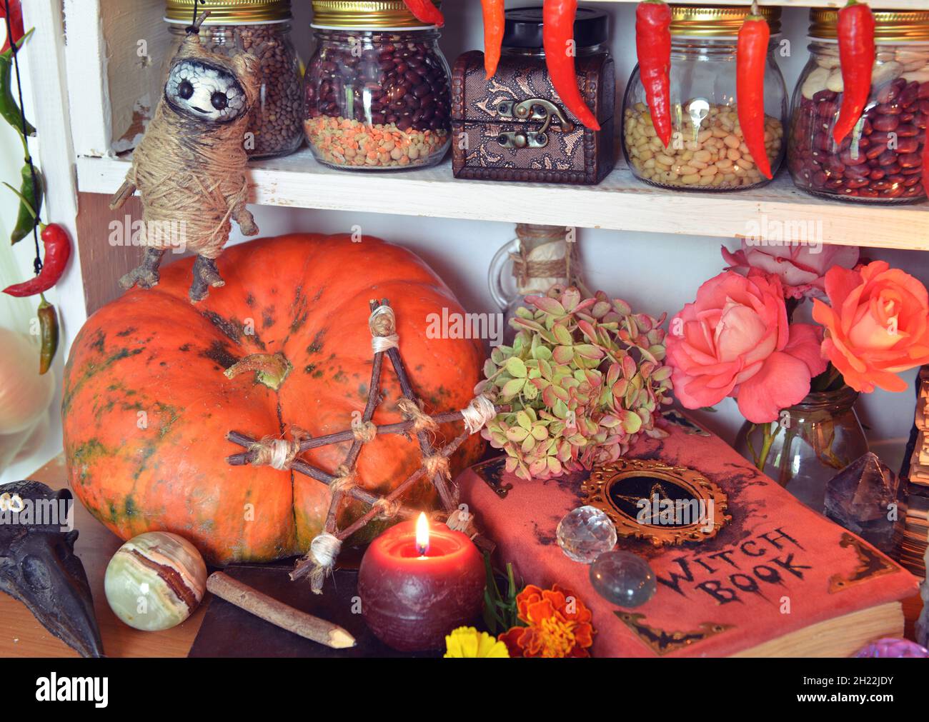 Esoteric still life with voodoo doll, pentagram, old bottles of herbs ...