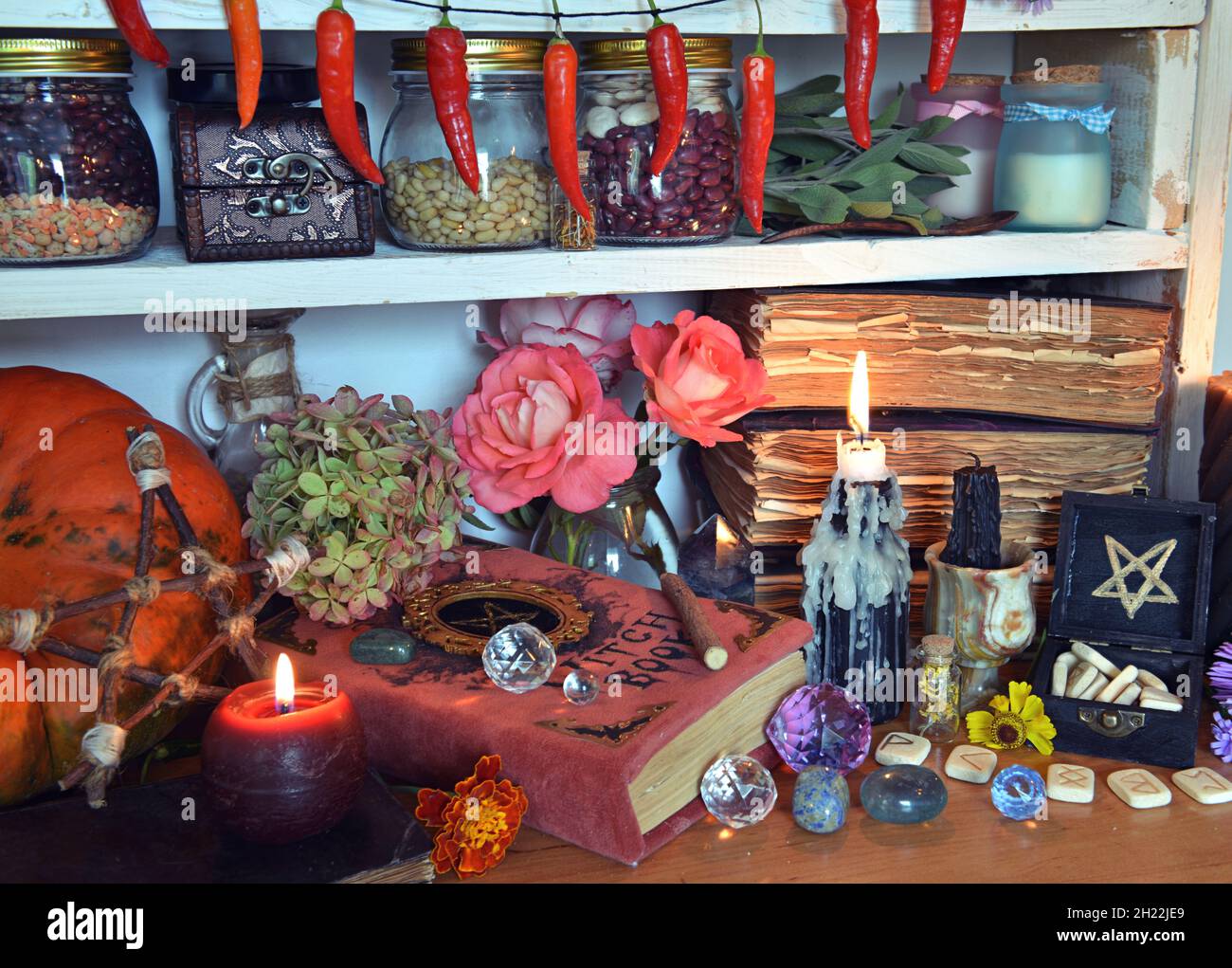 Mystic still life with witch ritual objects, burning candle, book of ...