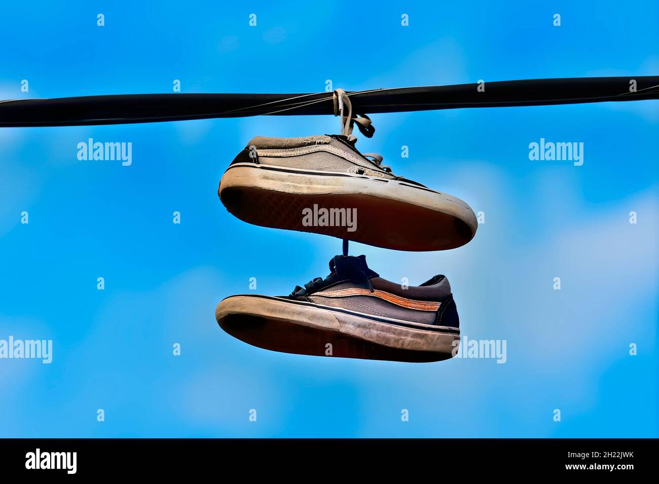 A pair of running shoes thrown over a power wire in New Brunswick ...