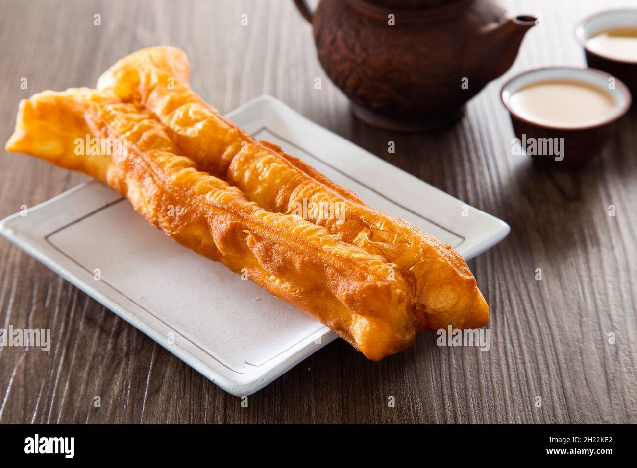 Youtiao (Chinese fried breadstick). Long golden brown deep fried dough ...