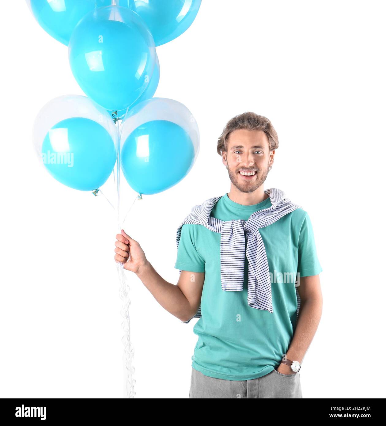 Young man with air balloons on white background Stock Photo - Alamy