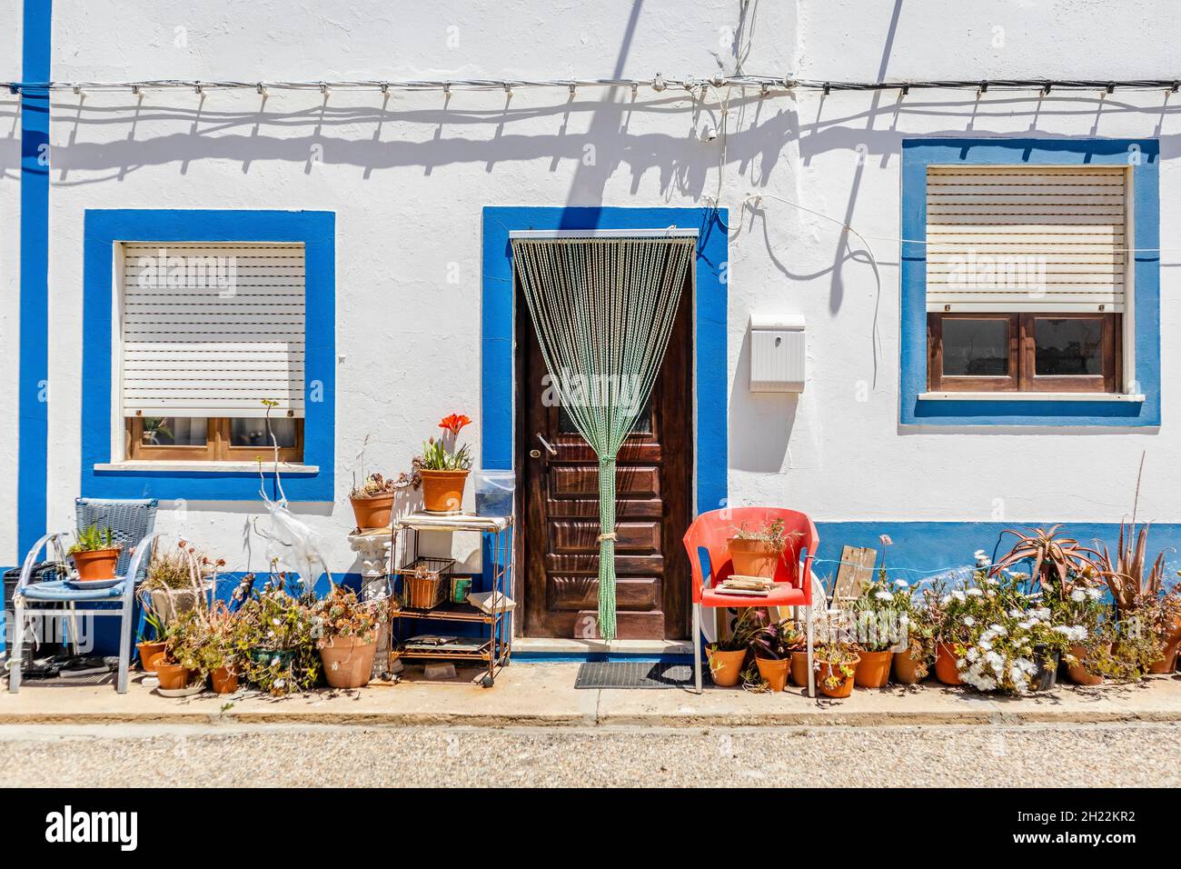 Exterior of traditional Portuguese house with urban garden in front of ...