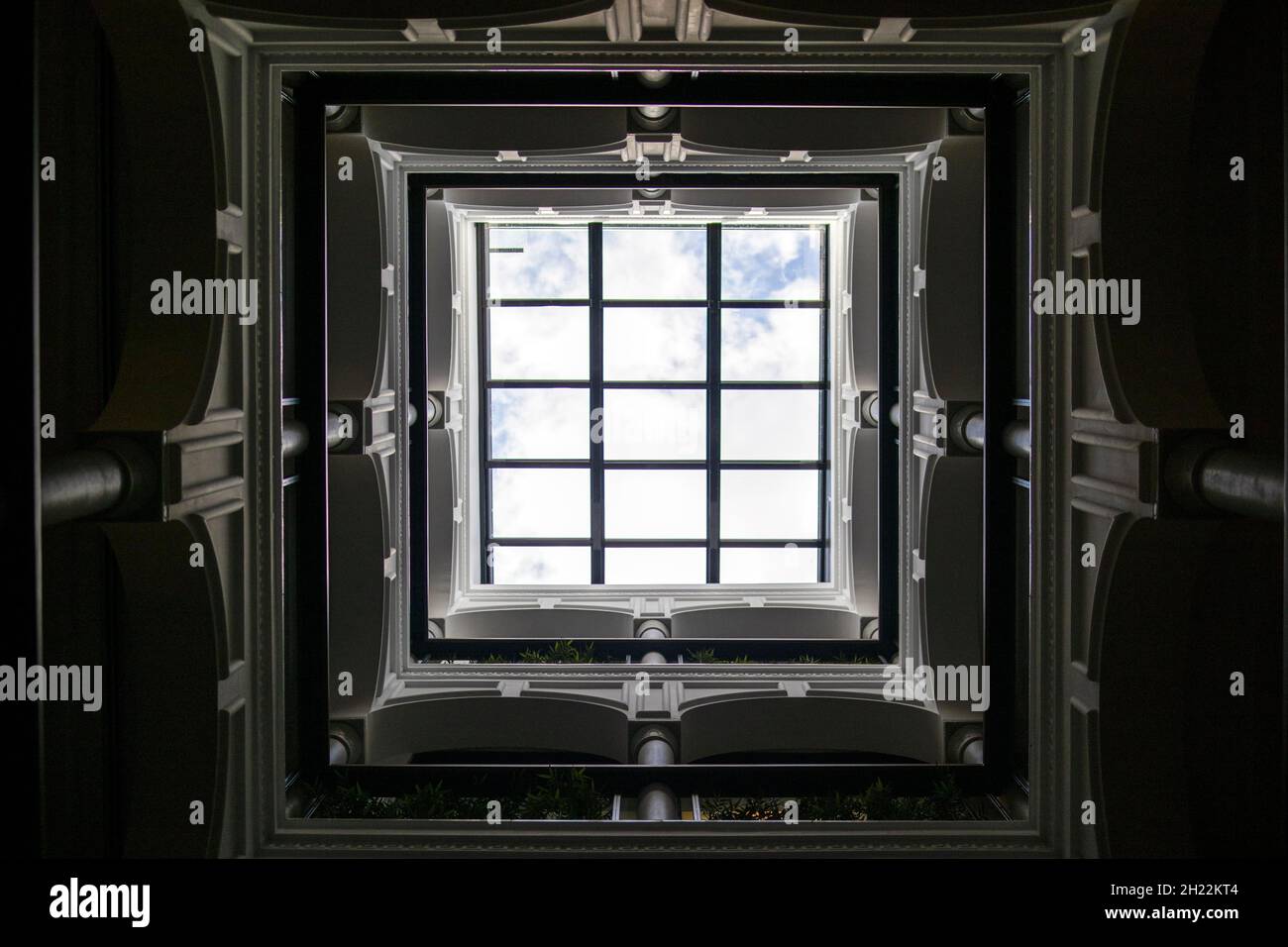 Interior of the small courtyard covered with glass in an old renovated ...