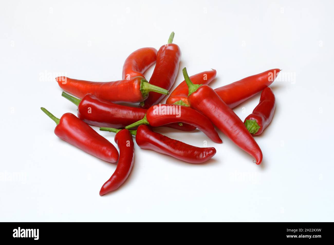 Red peppers on white background, Germany Stock Photo - Alamy