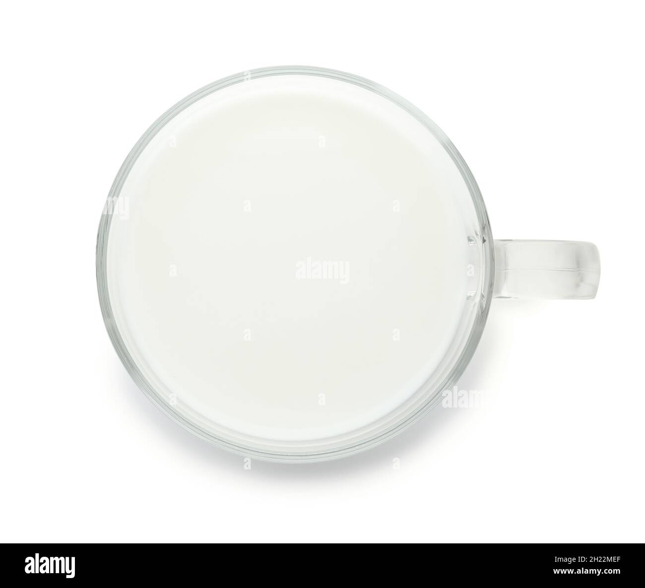 Glass cup with fresh milk on white background, top view Stock Photo - Alamy