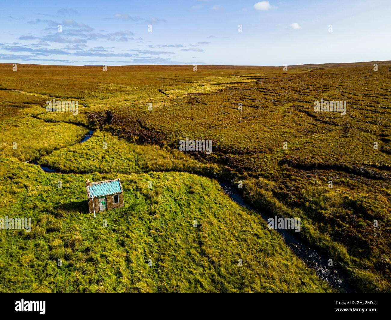 Aerial of a little hut in the Moorland on the Isle of Lewis, Outer ...
