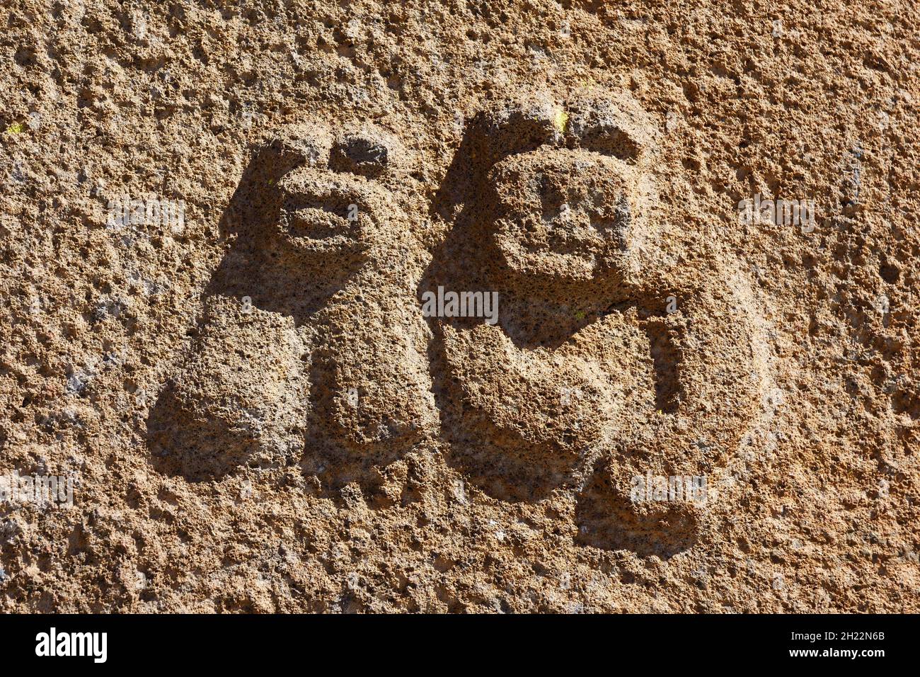 Stone tombs, Chullpas of Cutimbo, detail relief monkey, Lake Titicaca ...
