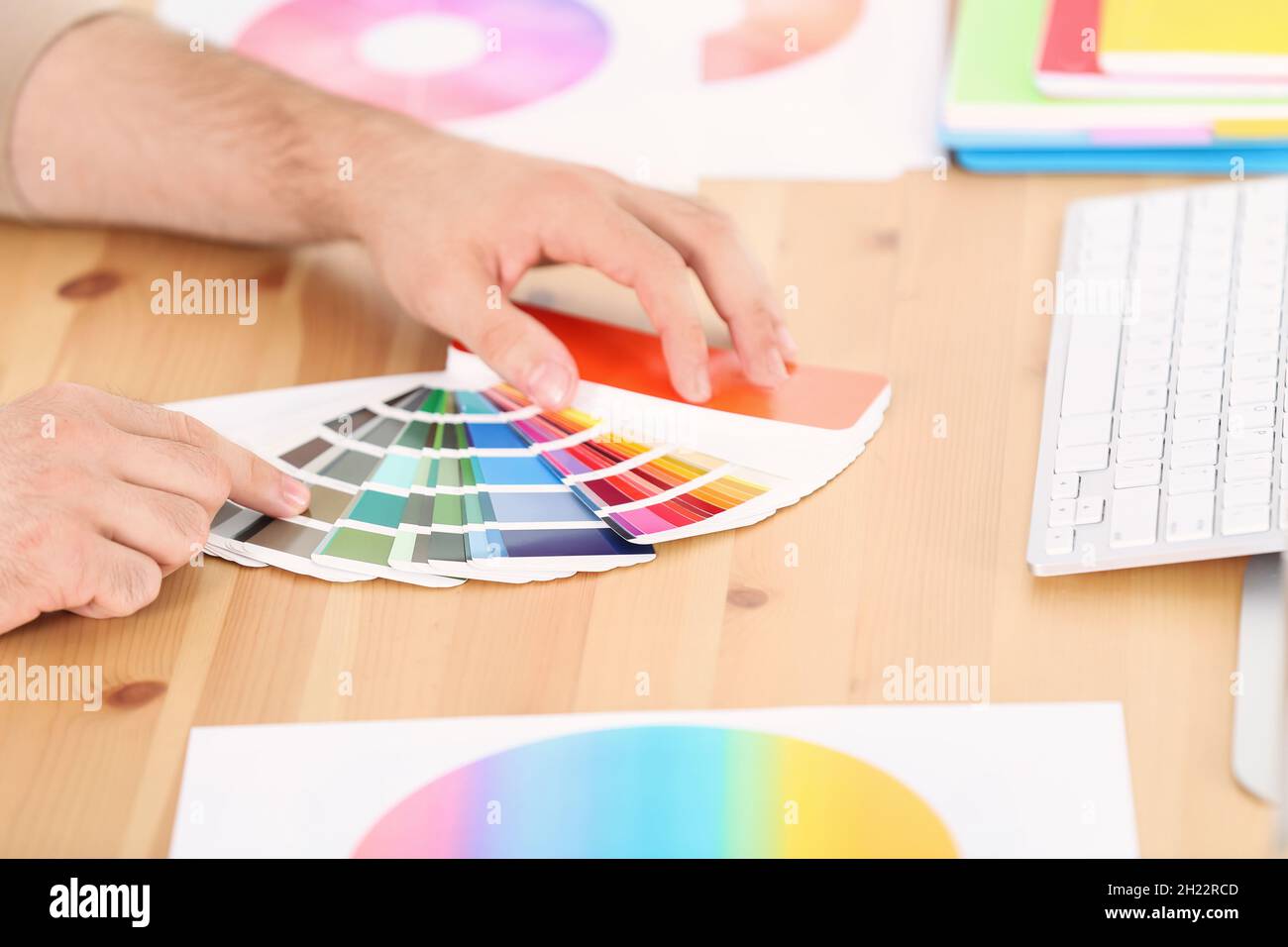 Designer with paint color palette samples at table, closeup Stock Photo ...