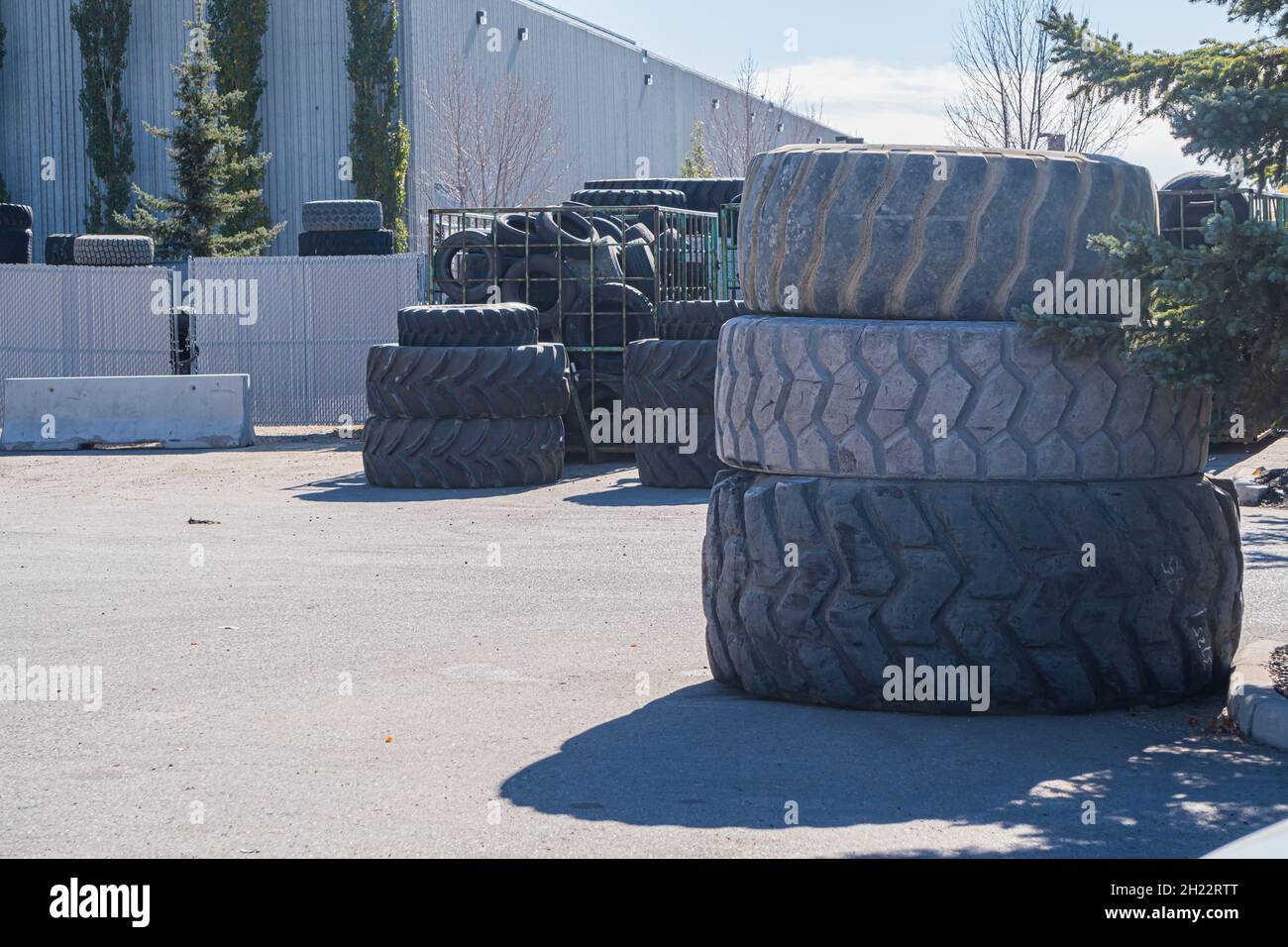 Old tires stacked up together at a car workshop garage Stock Photo - Alamy