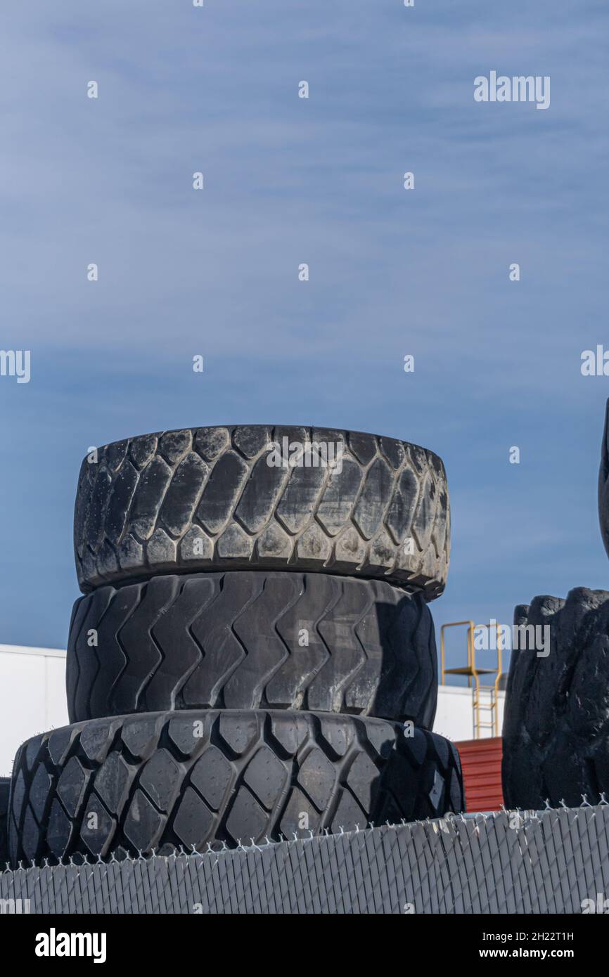 Old tires stacked up together at a car workshop garage Stock Photo - Alamy