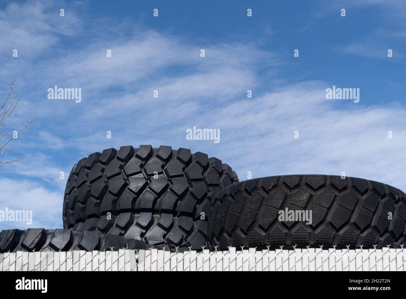 Old tires stacked up together at a car workshop garage Stock Photo - Alamy